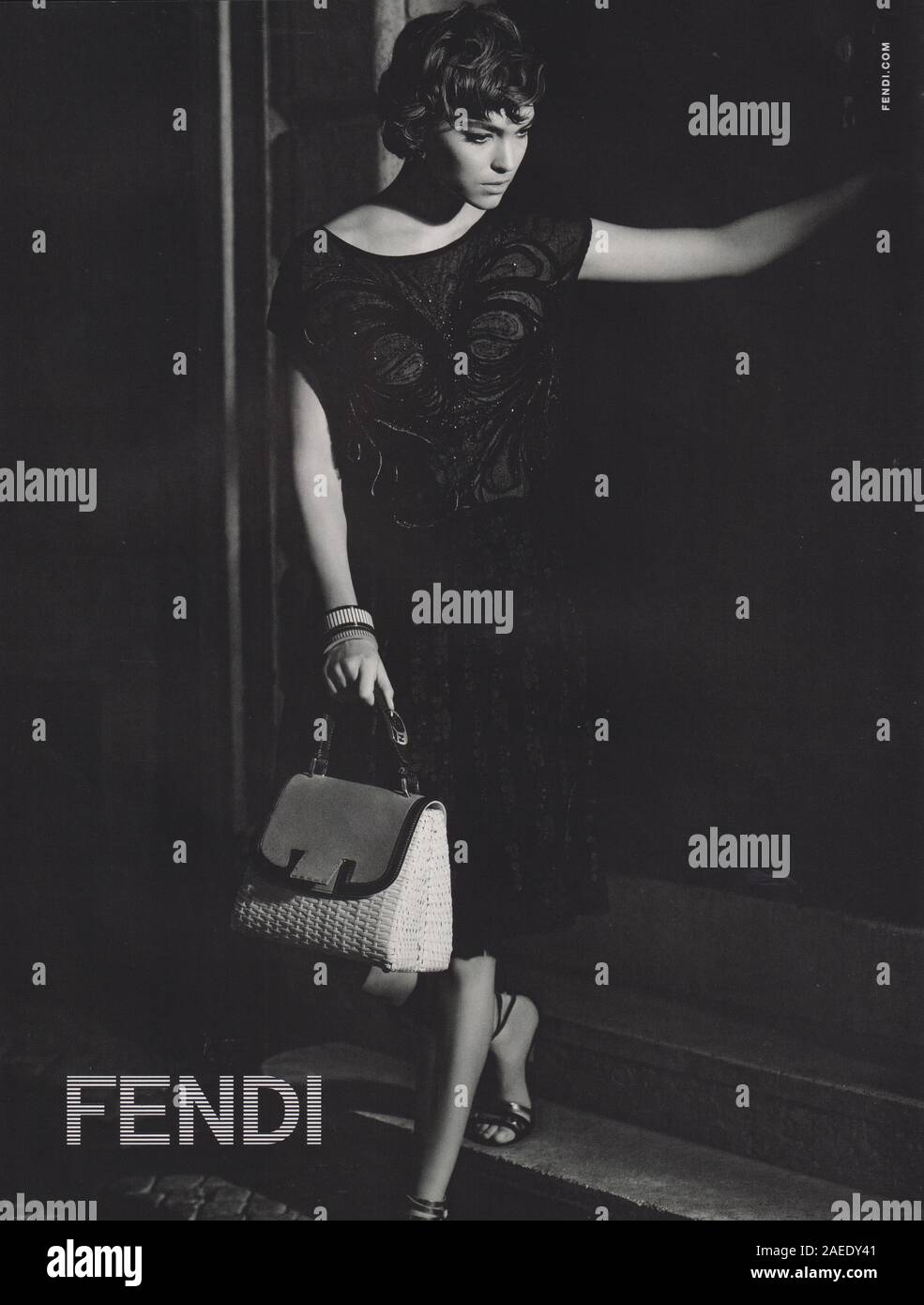 poster advertising FENDI fashion house with Arizona Muse in paper ...