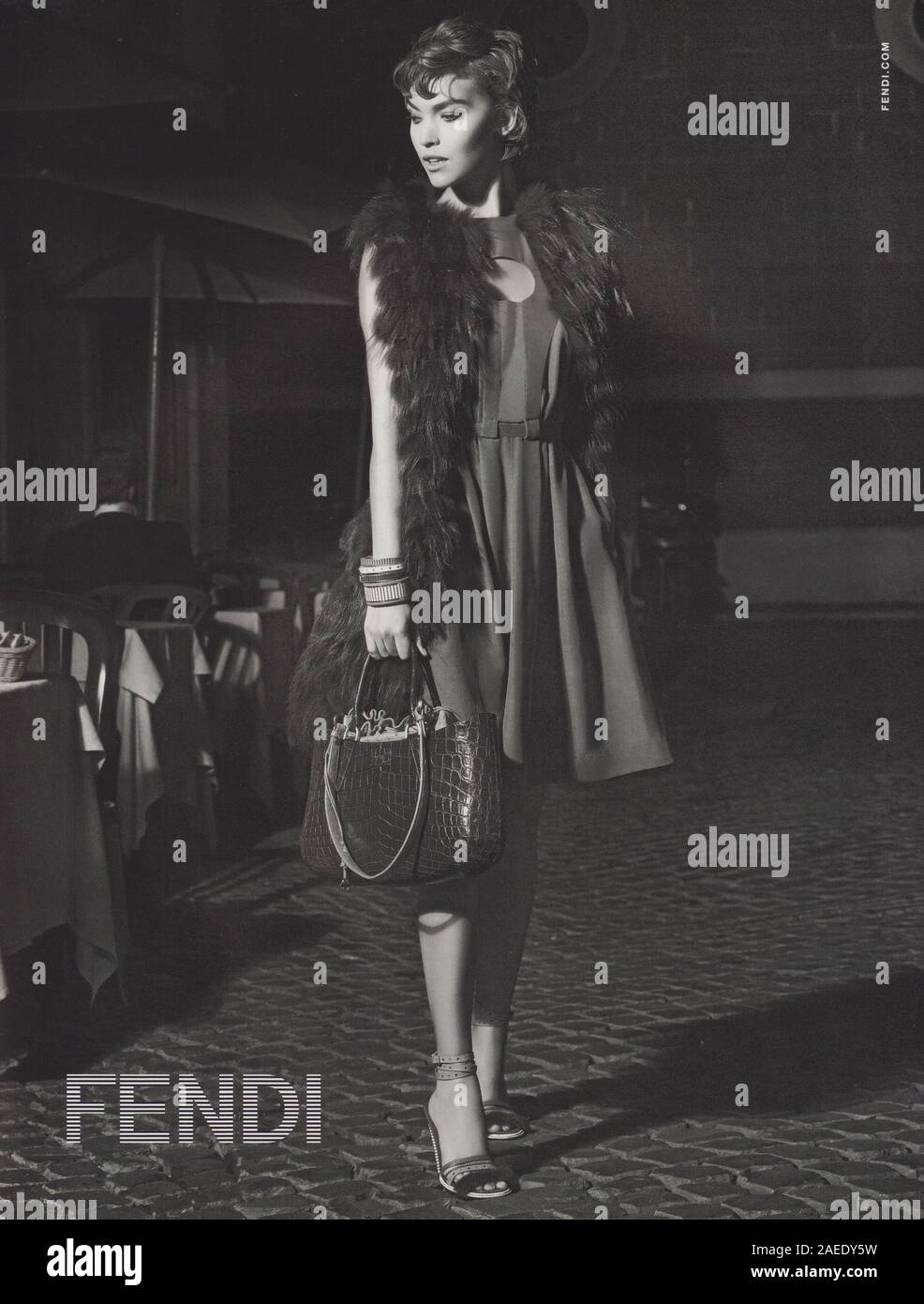 poster advertising FENDI fashion house with Arizona Muse in paper ...