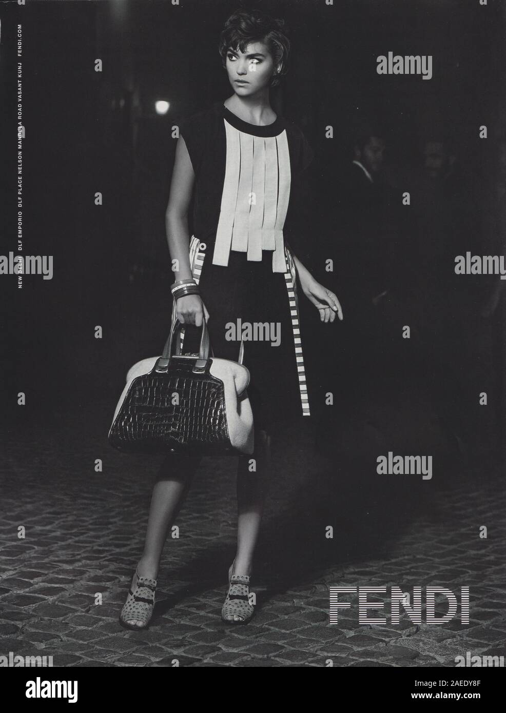 poster advertising FENDI fashion house with Arizona Muse in paper ...