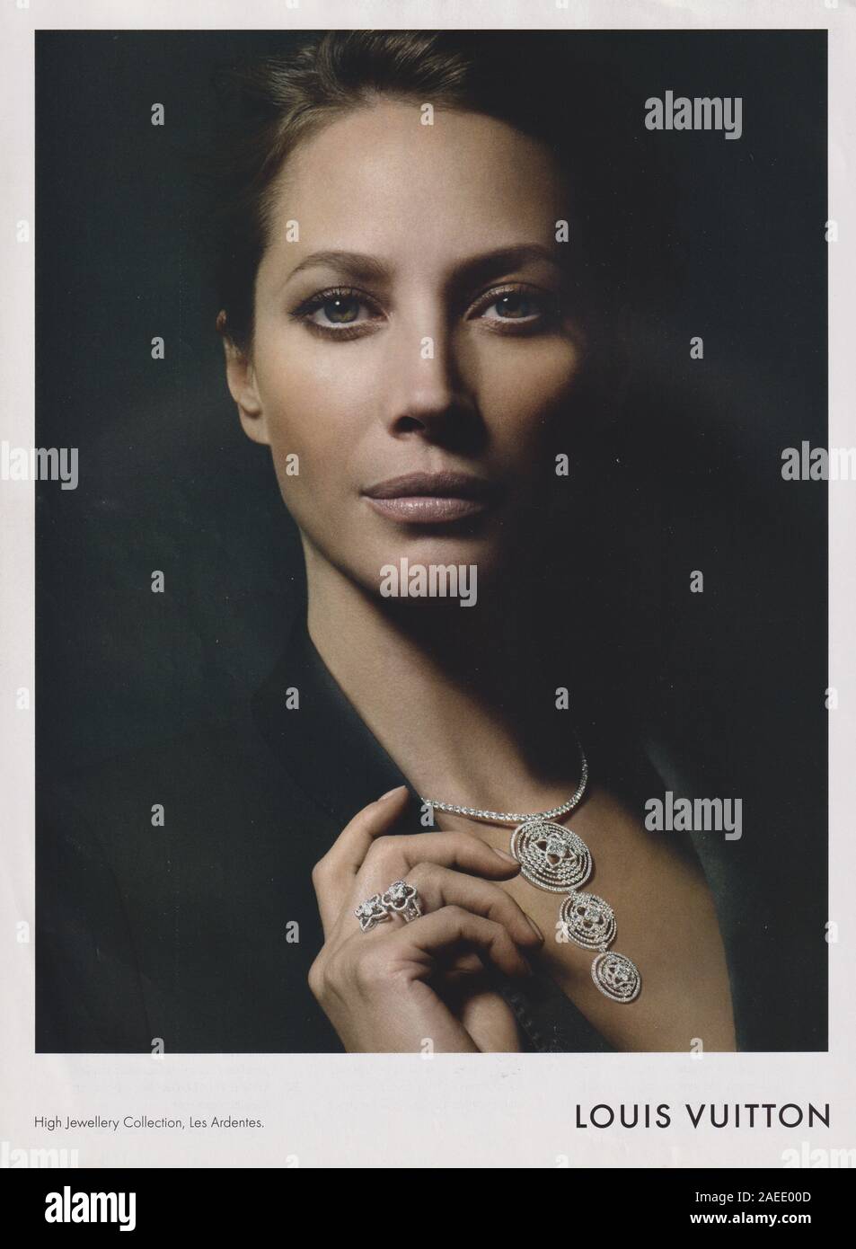 poster advertising Louis Vuitton with Christy Turlington in paper ...