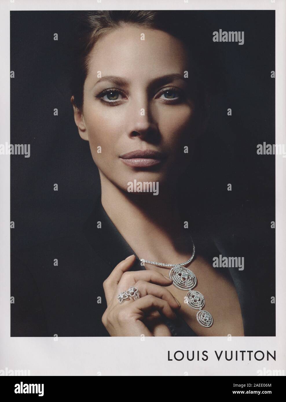 poster advertising Louis Vuitton with Christy Turlington in paper ...