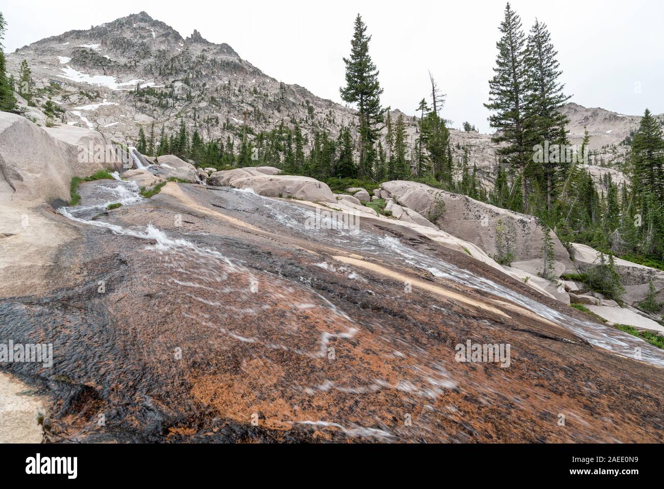 Stream flowing down a rock slab in Idaho's Sawtooth Mountains Stock ...