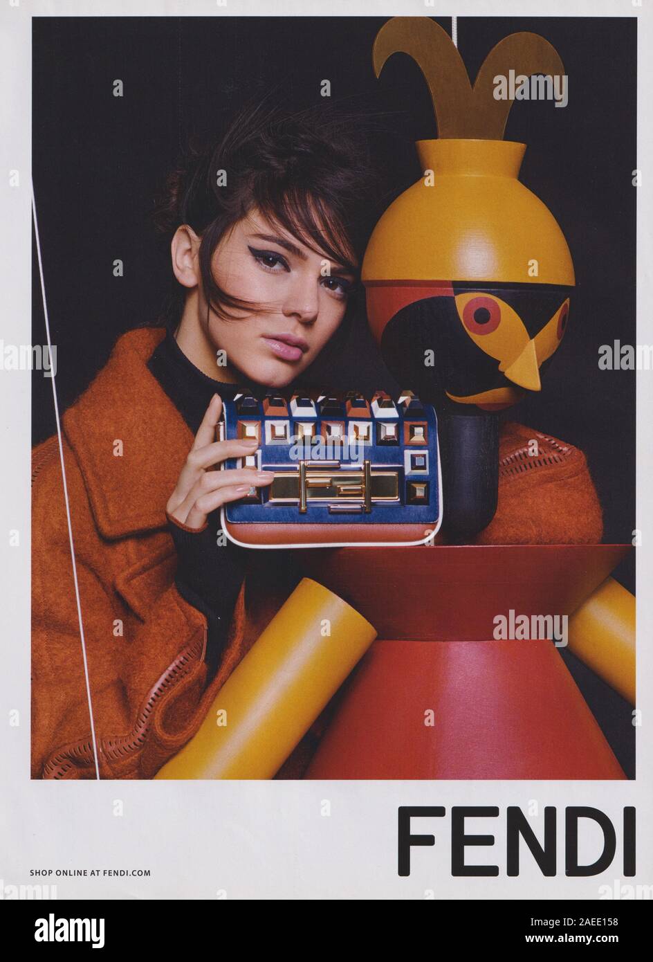 poster advertising FENDI fashion house with Kendall Jenner in paper ...