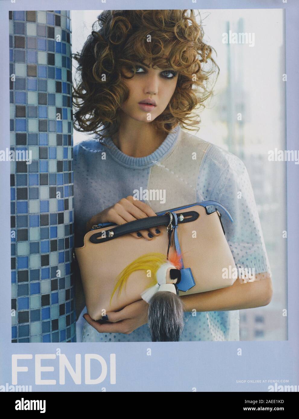 poster advertising FENDI fashion house with Lindsey Wixson in paper ...