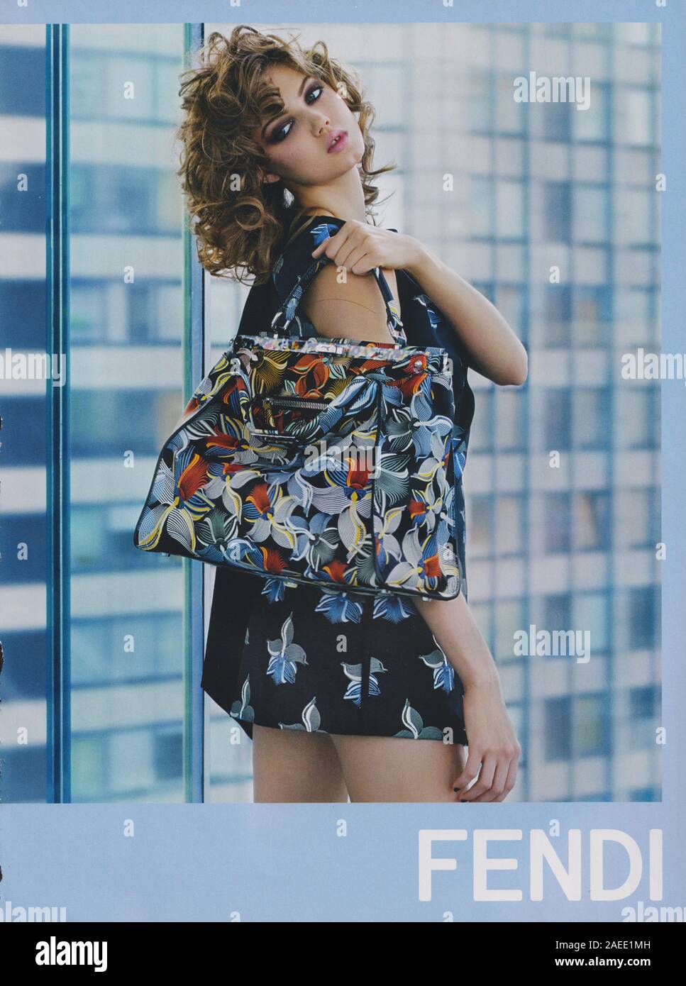 poster advertising FENDI fashion house with Lindsey Wixson in paper ...