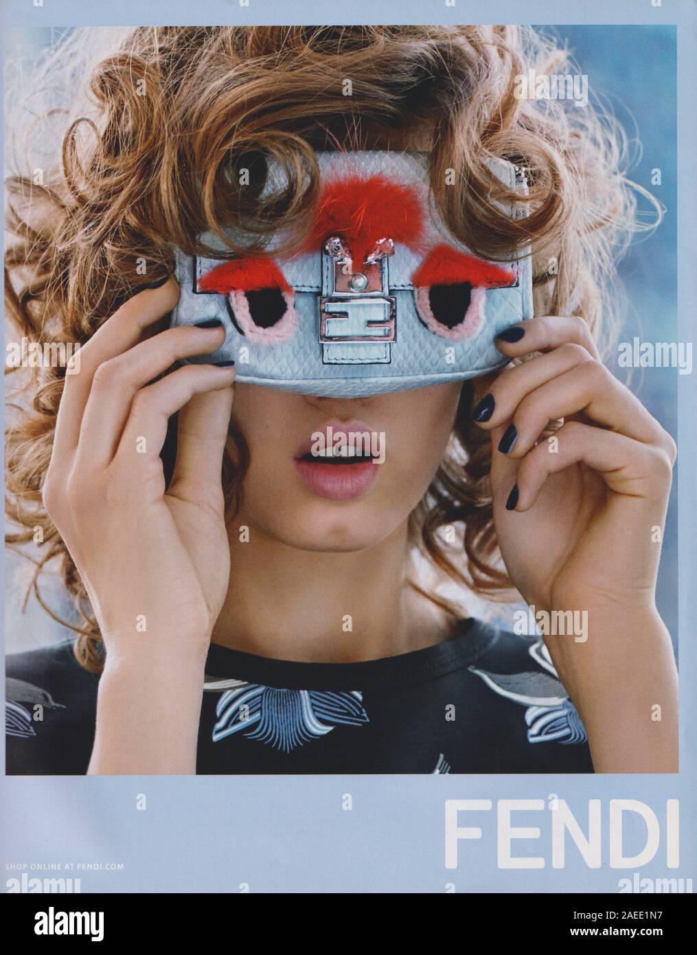 poster advertising FENDI fashion house with Lindsey Wixson in paper ...