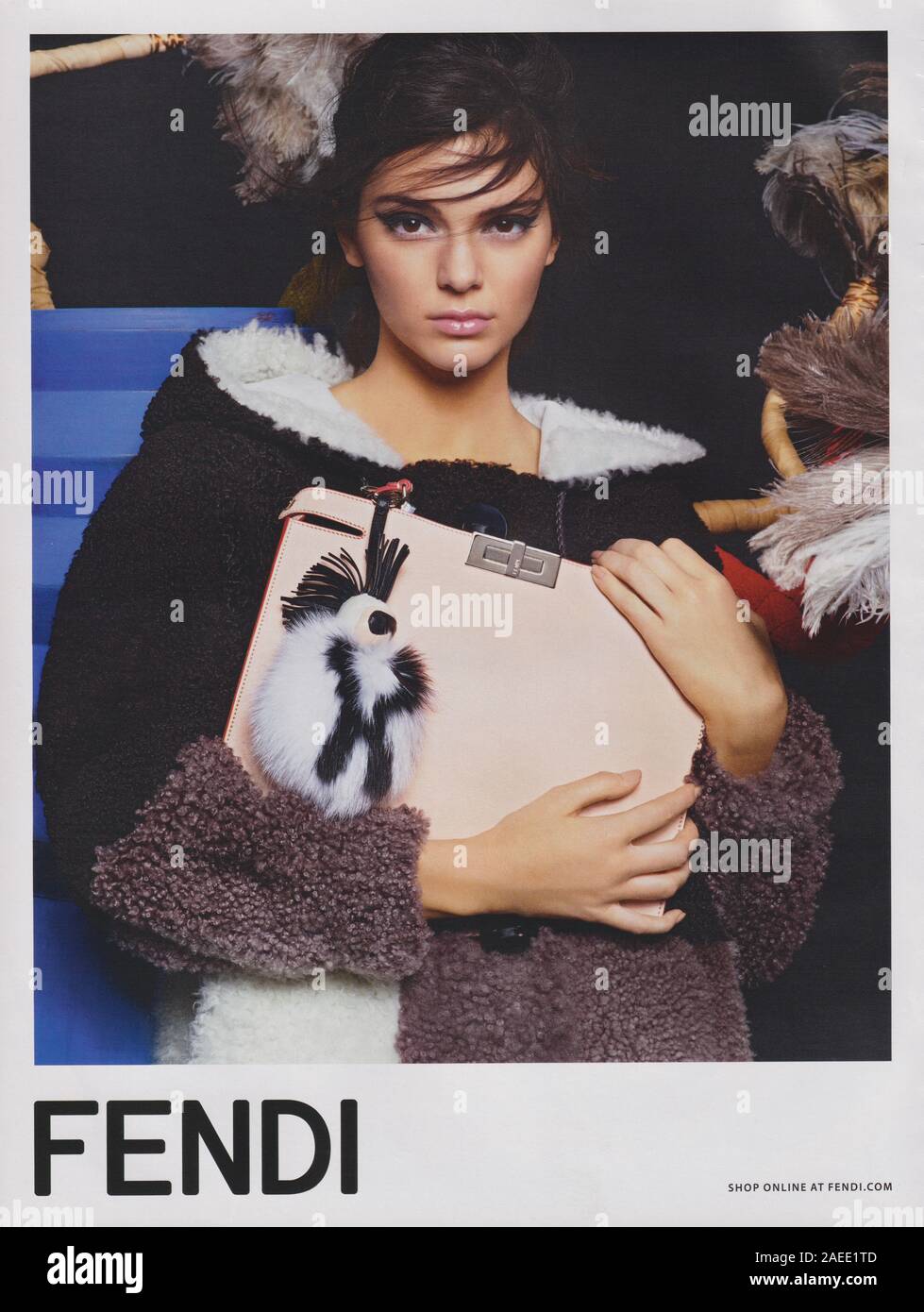 poster advertising FENDI fashion house with Kendall Jenner in paper ...