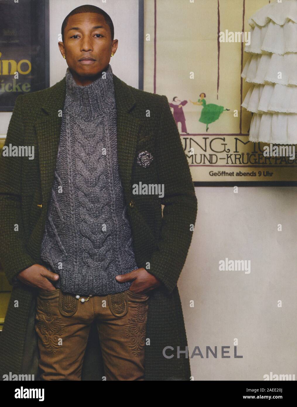 poster advertising CHANEL fashion house with Pharrell Williams in paper ...