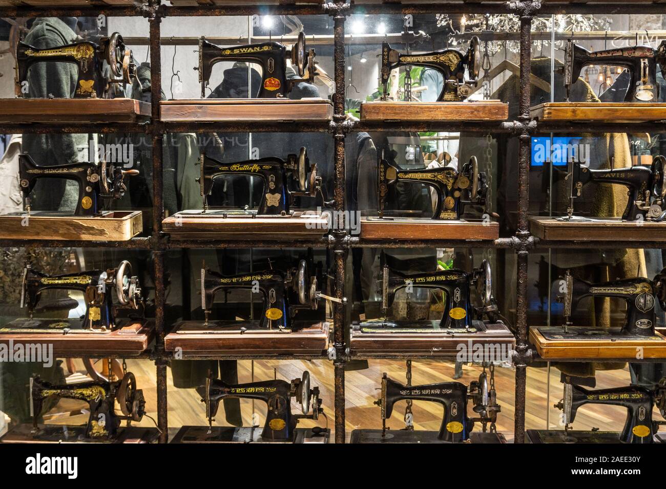 Rows and columns of antique sewing machines in China Stock Photo - Alamy