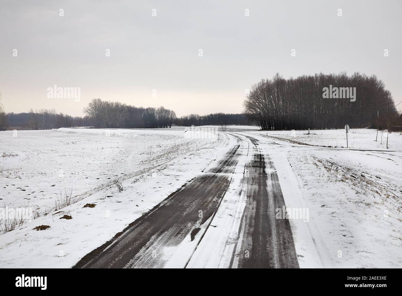 Rural road in snow in winter Stock Photo - Alamy