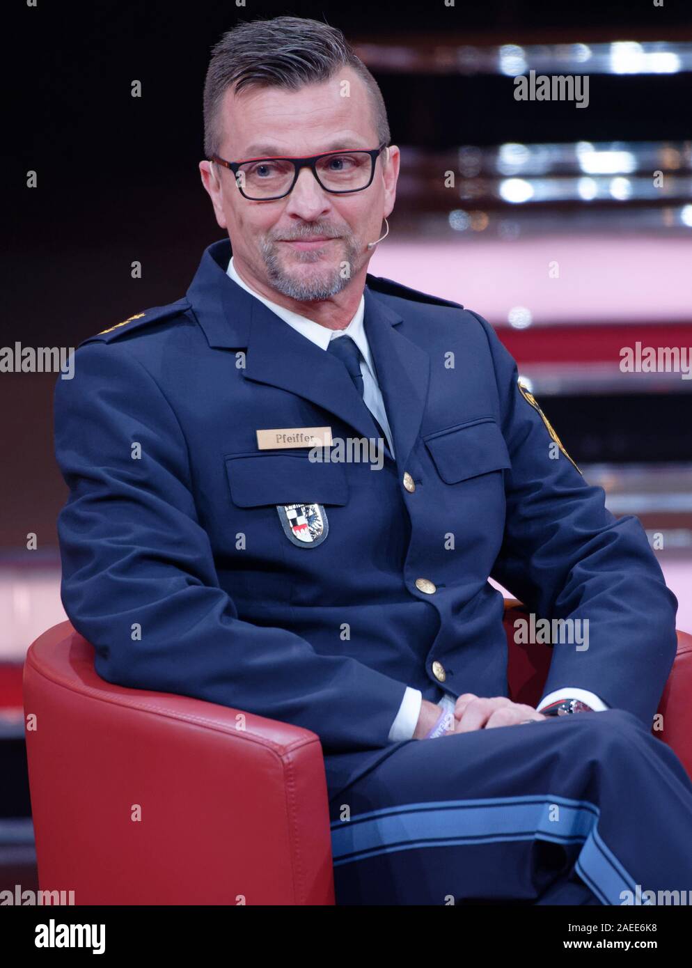 Cologne, Germany. 09th Dec, 2019. Police officer Stefan Pfeiffer sits at the RTL annual review ...