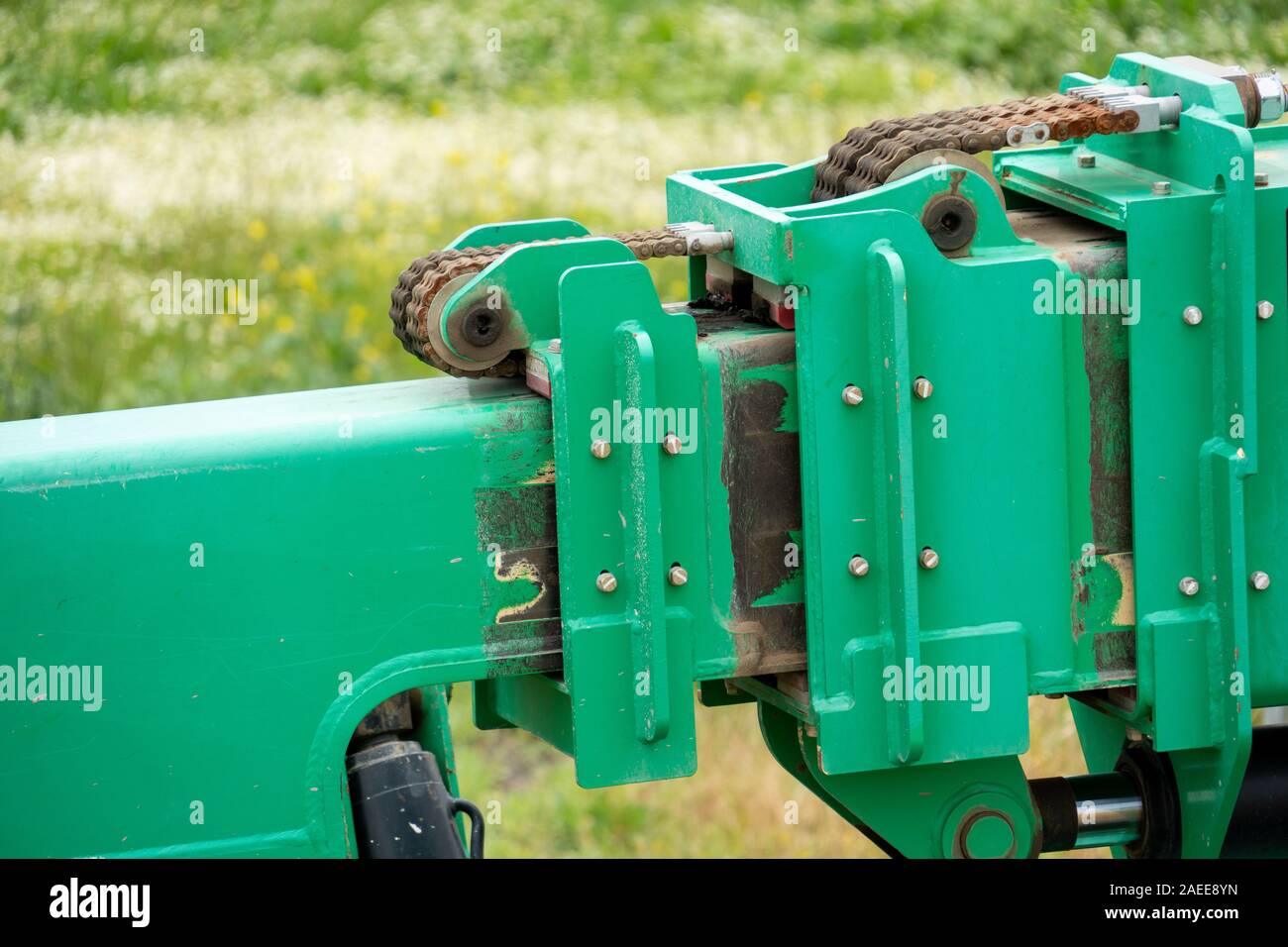 Large green tractor heavy equipment boom arm close up Stock Photo - Alamy