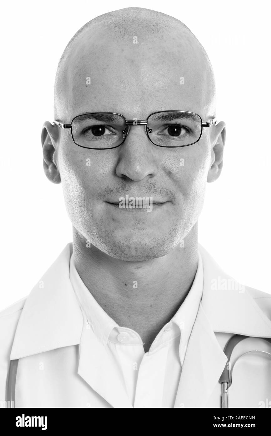 Face of young handsome bald man doctor wearing eyeglasses Stock Photo ...