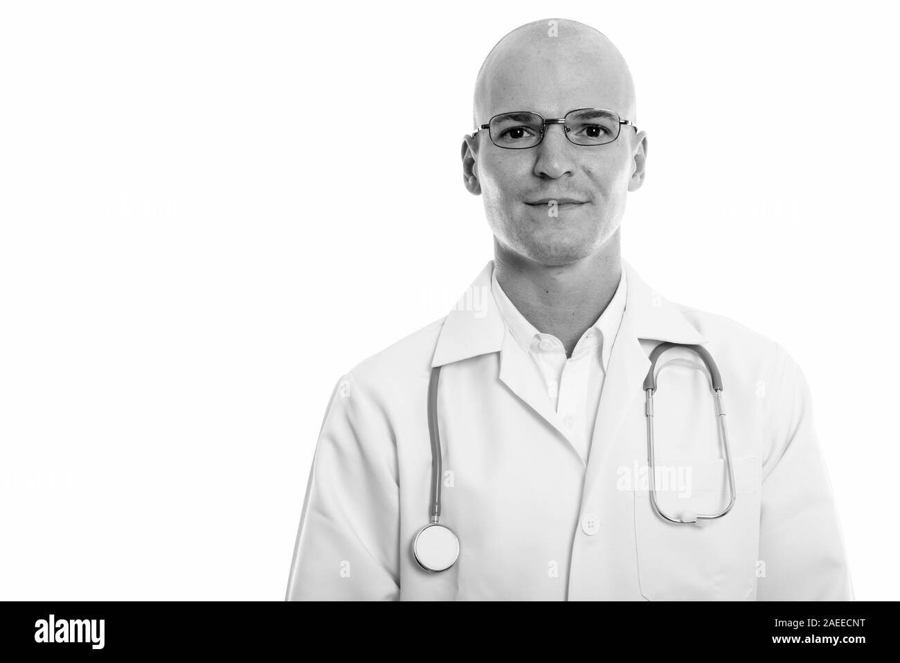 Young handsome bald man doctor wearing eyeglasses Stock Photo - Alamy