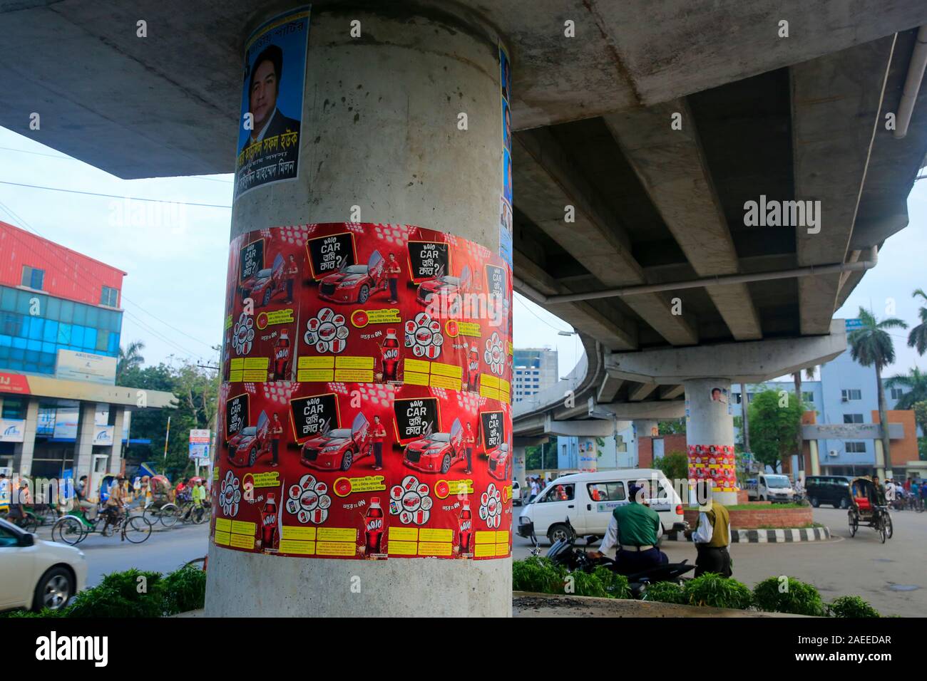 Pillars of Moghbazar-Mouchak Flyover are covered with advertising ...