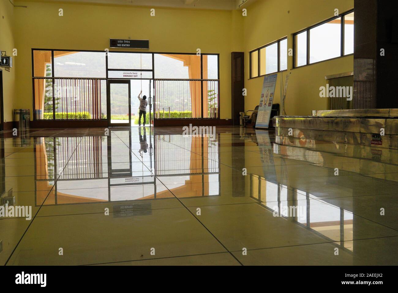 Cleaning window, Kullu airport interior, Himachal Pradesh, India, Asia ...