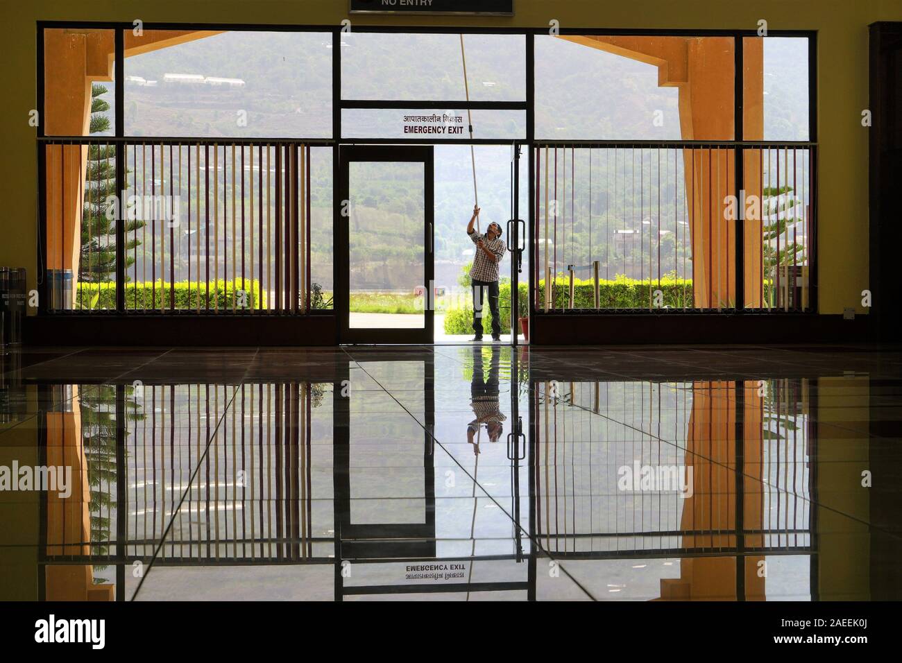 Cleaning window, Kullu airport interior, Himachal Pradesh, India, Asia ...
