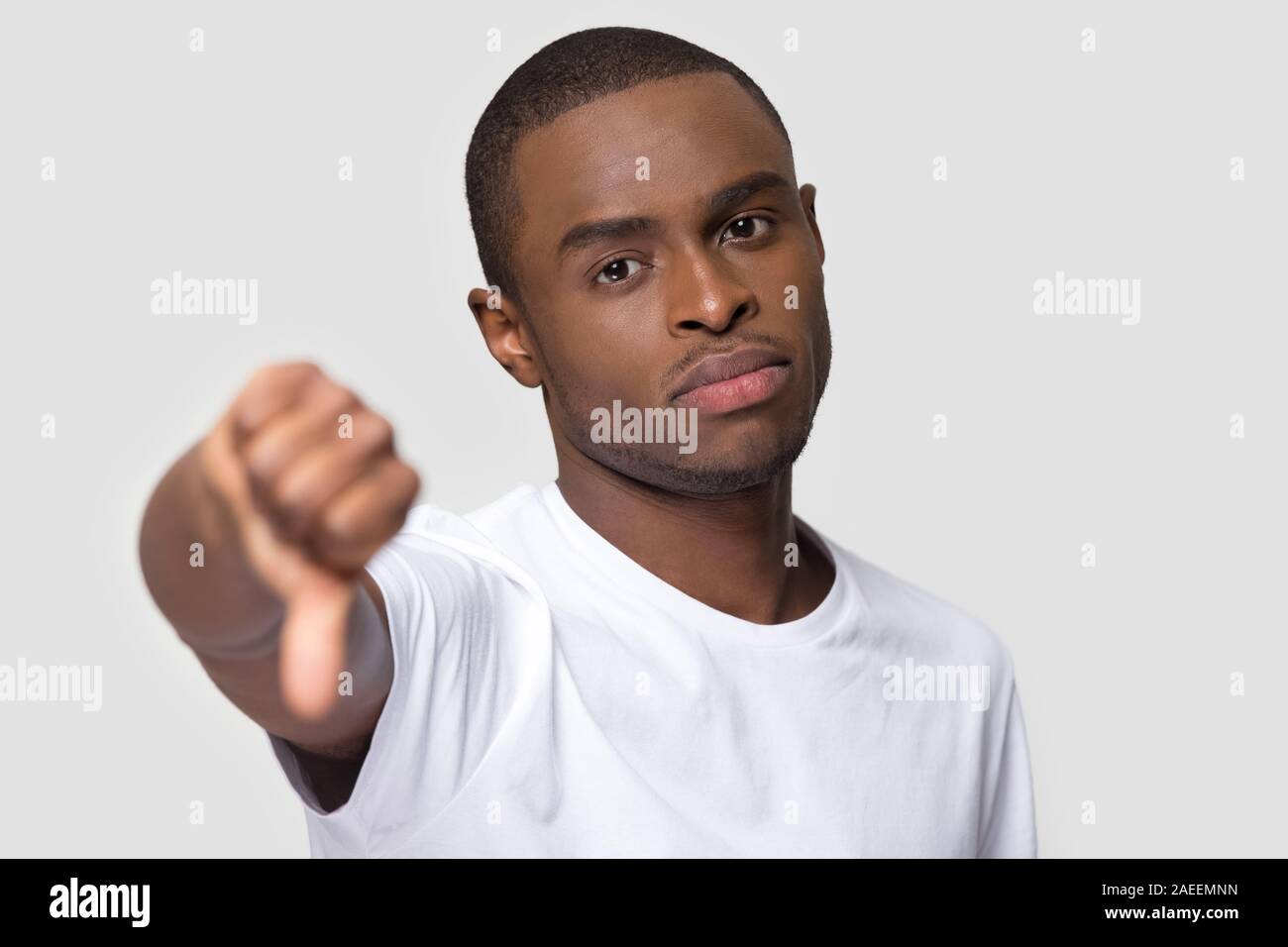 African man showing thumbs down hi-res stock photography and images - Alamy