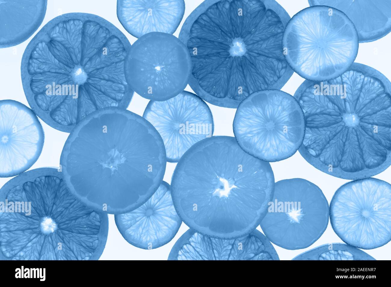 Citrus fruits toned in blue. Healthy food variety concept. Abstract art ...