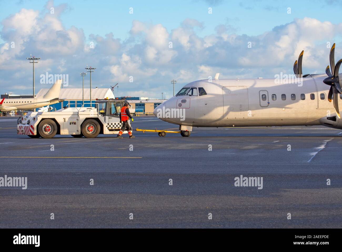 Turboprop aircraft towing airport, engine start preparation Stock Photo ...