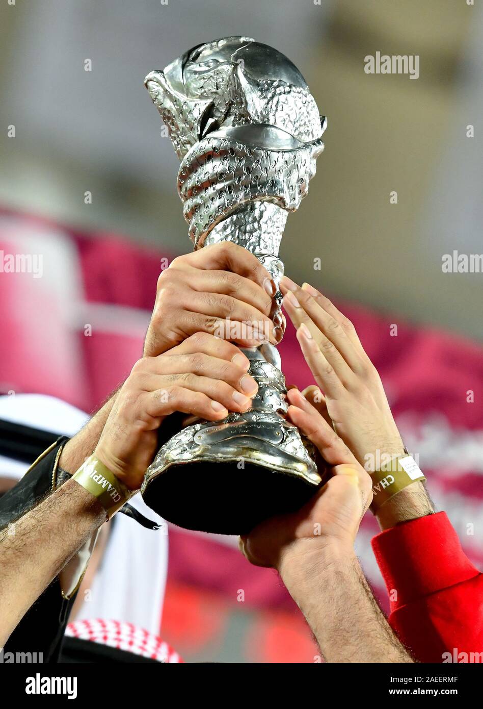 Doha, Qatar. 8th Dec, 2019. Bahrain's players hold up the trophy after ...