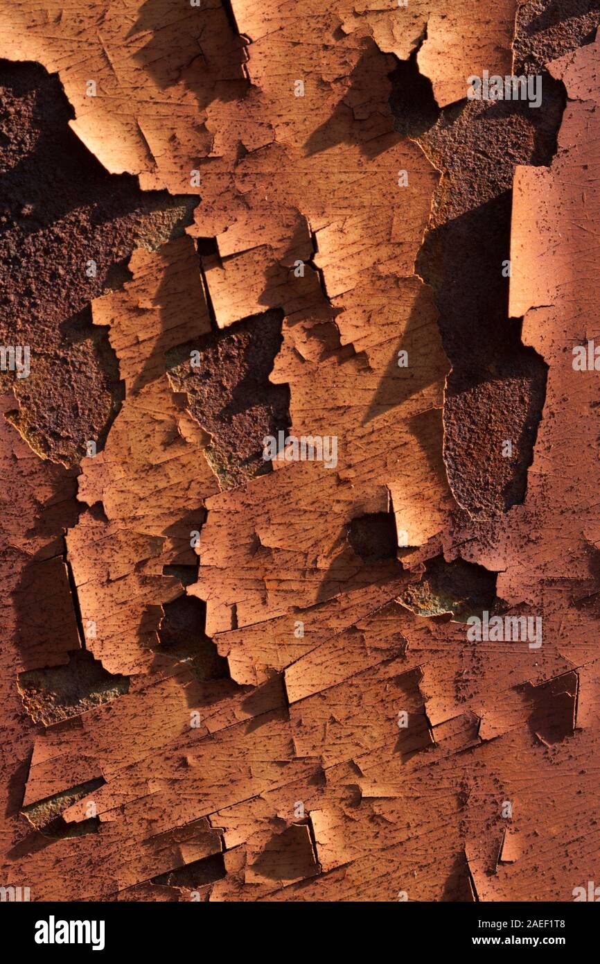 Peeling rust colored paint in evening sunlight Stock Photo - Alamy
