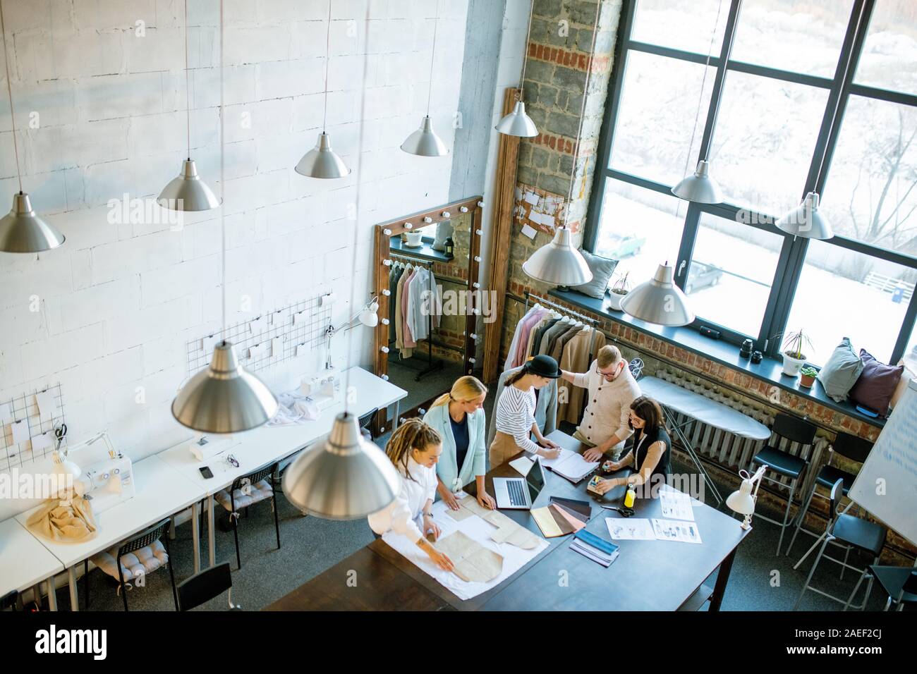 Group of young contemporary creative designers working over new ...