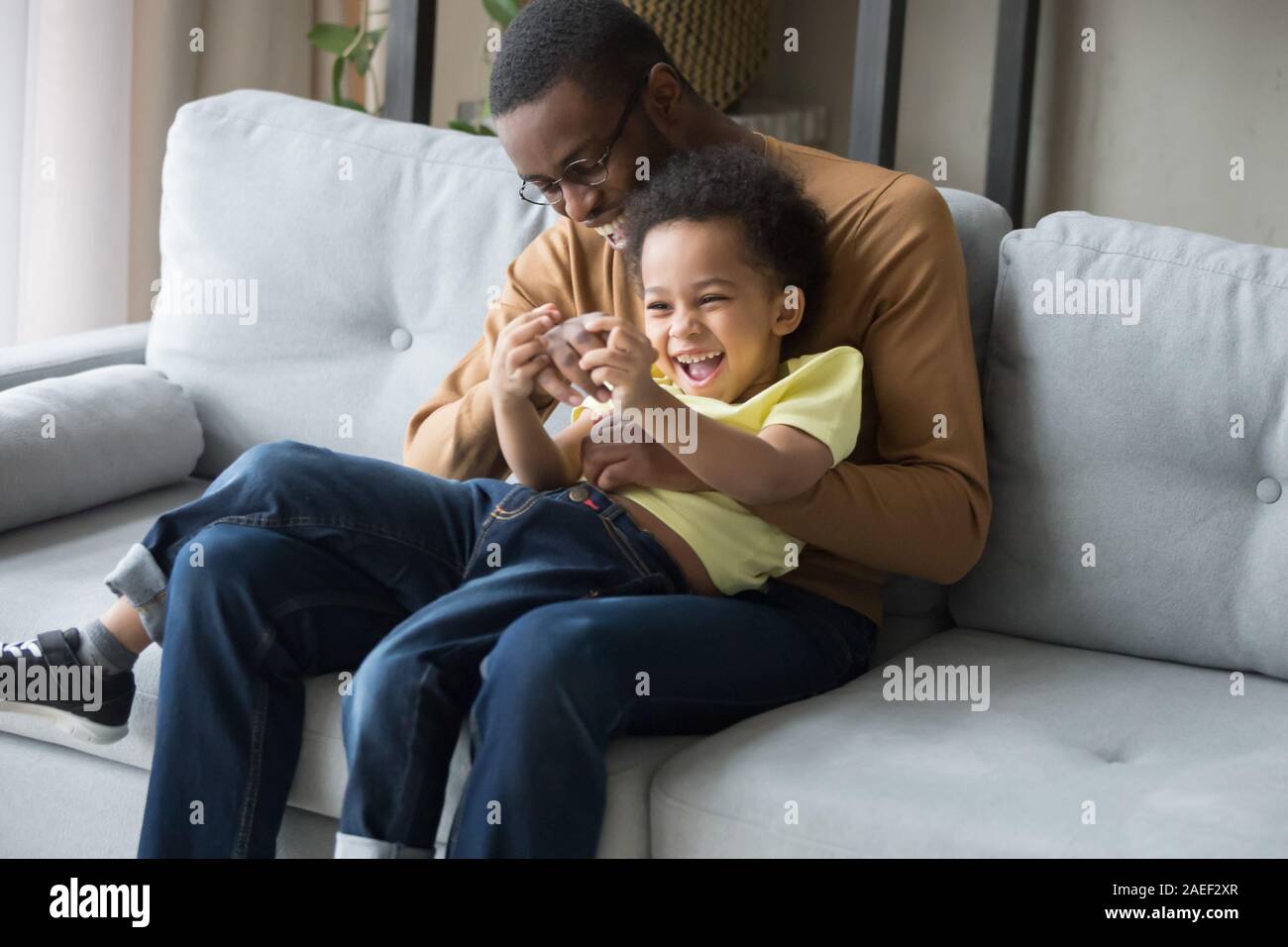 Happy black father and son have fun at home Stock Photo - Alamy