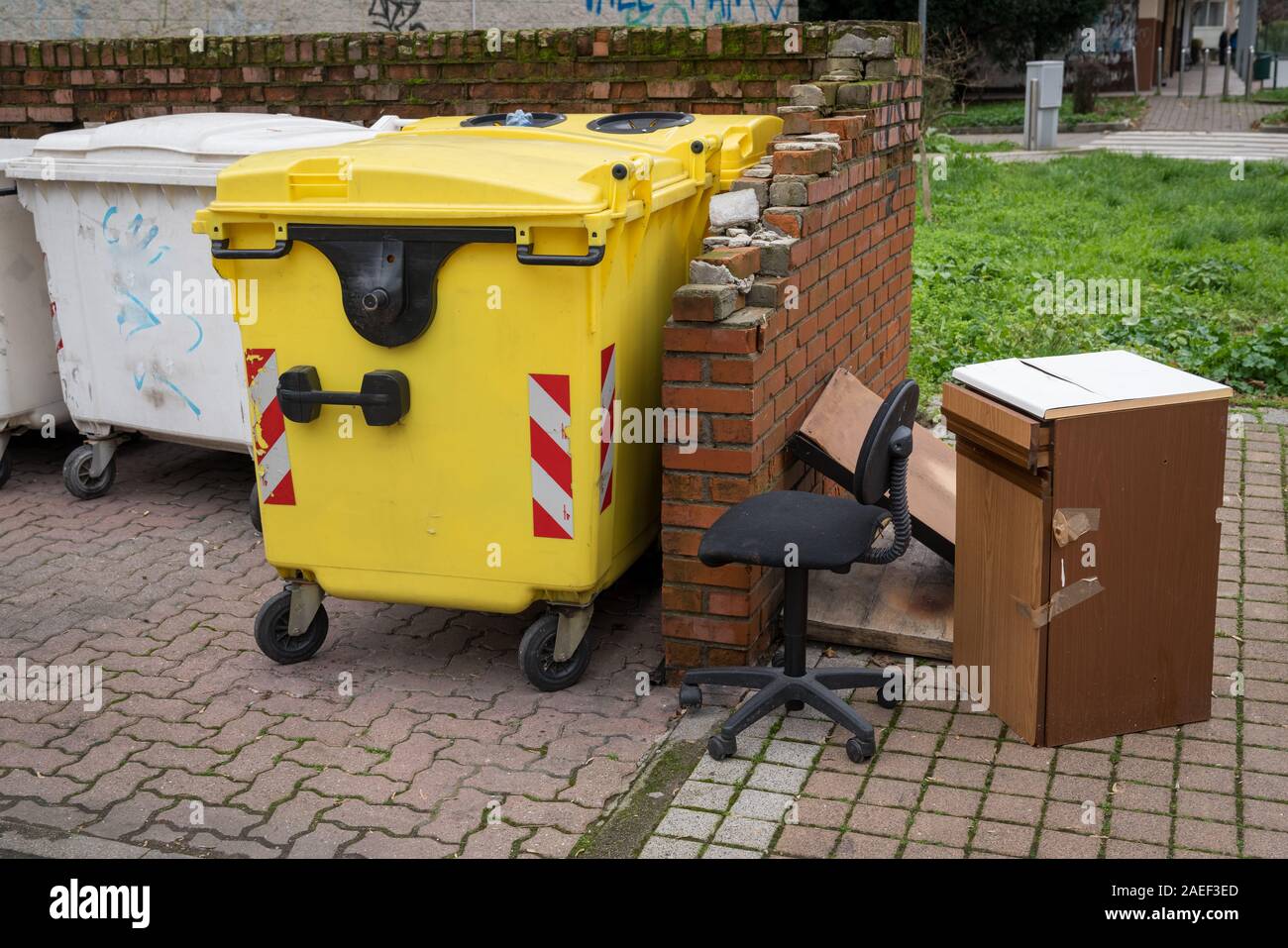 selective waste collection bins and waste deposited out of containers ...