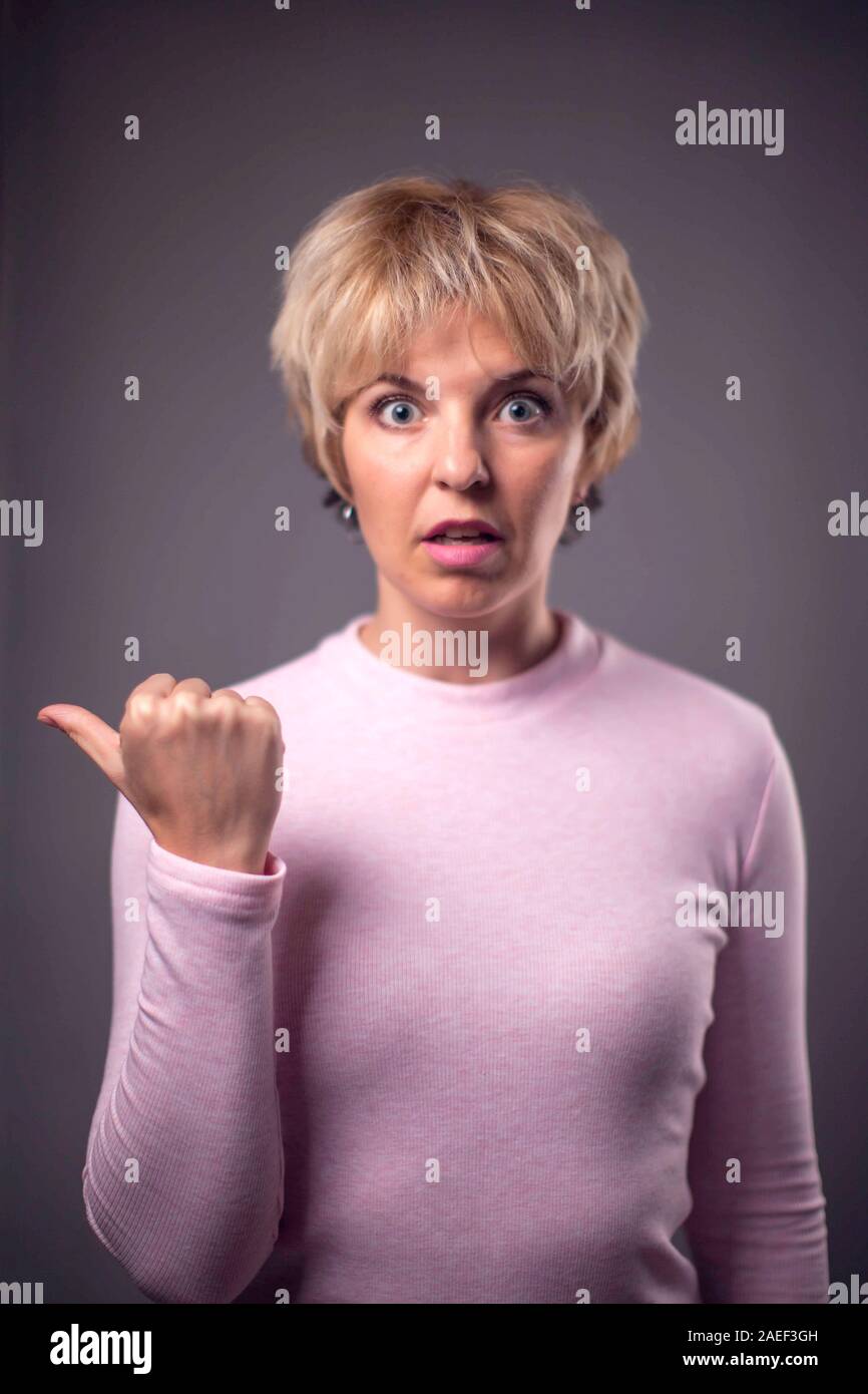 Female showing fingers on something. People and emotion concept Stock ...