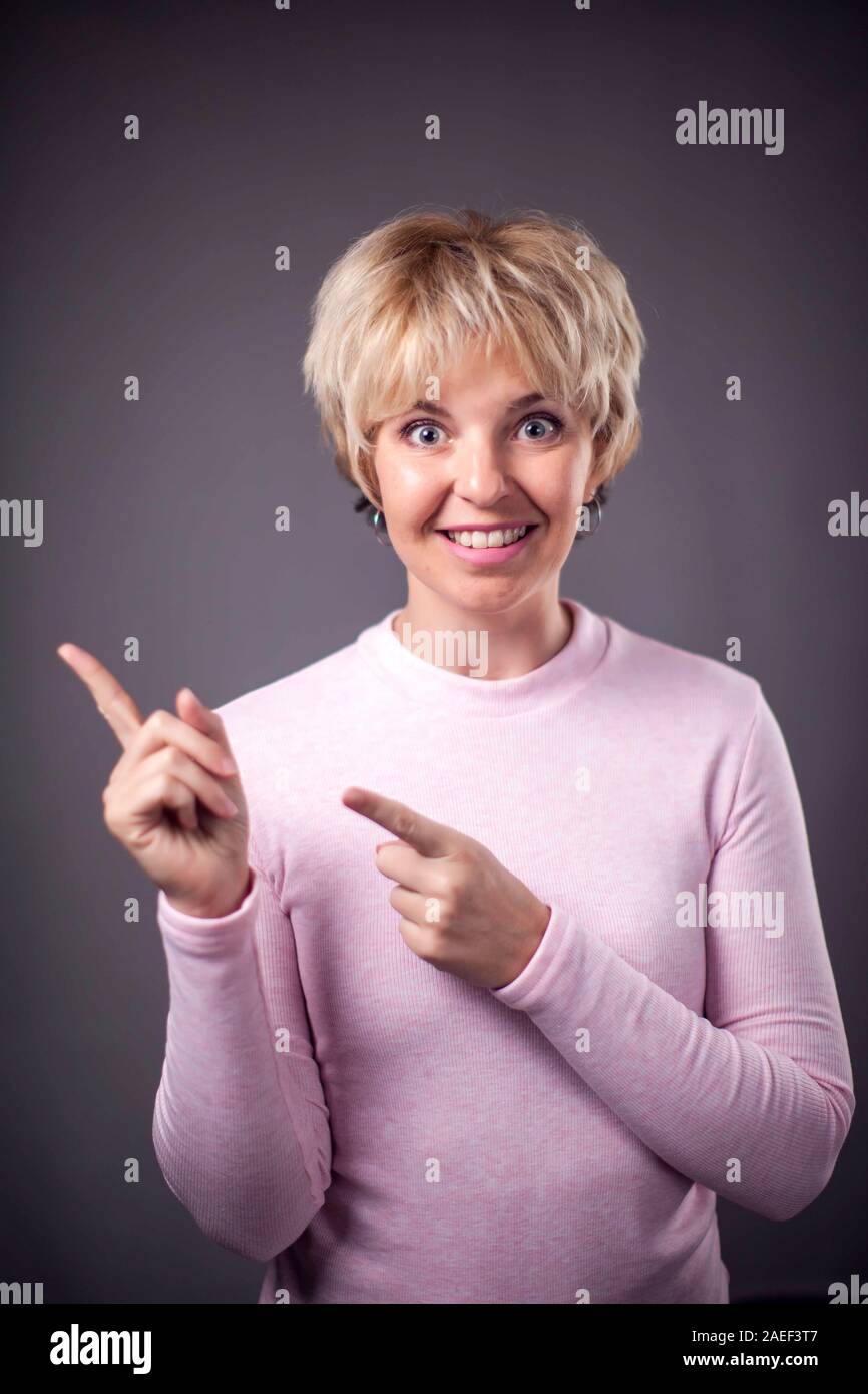 Female showing fingers on something. People and emotion concept Stock ...