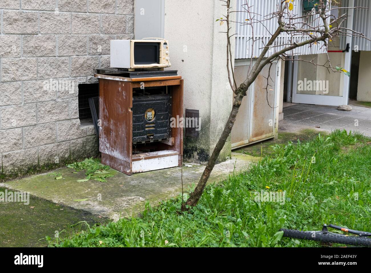 Waste deposited outside containers, urban pollution Stock Photo - Alamy