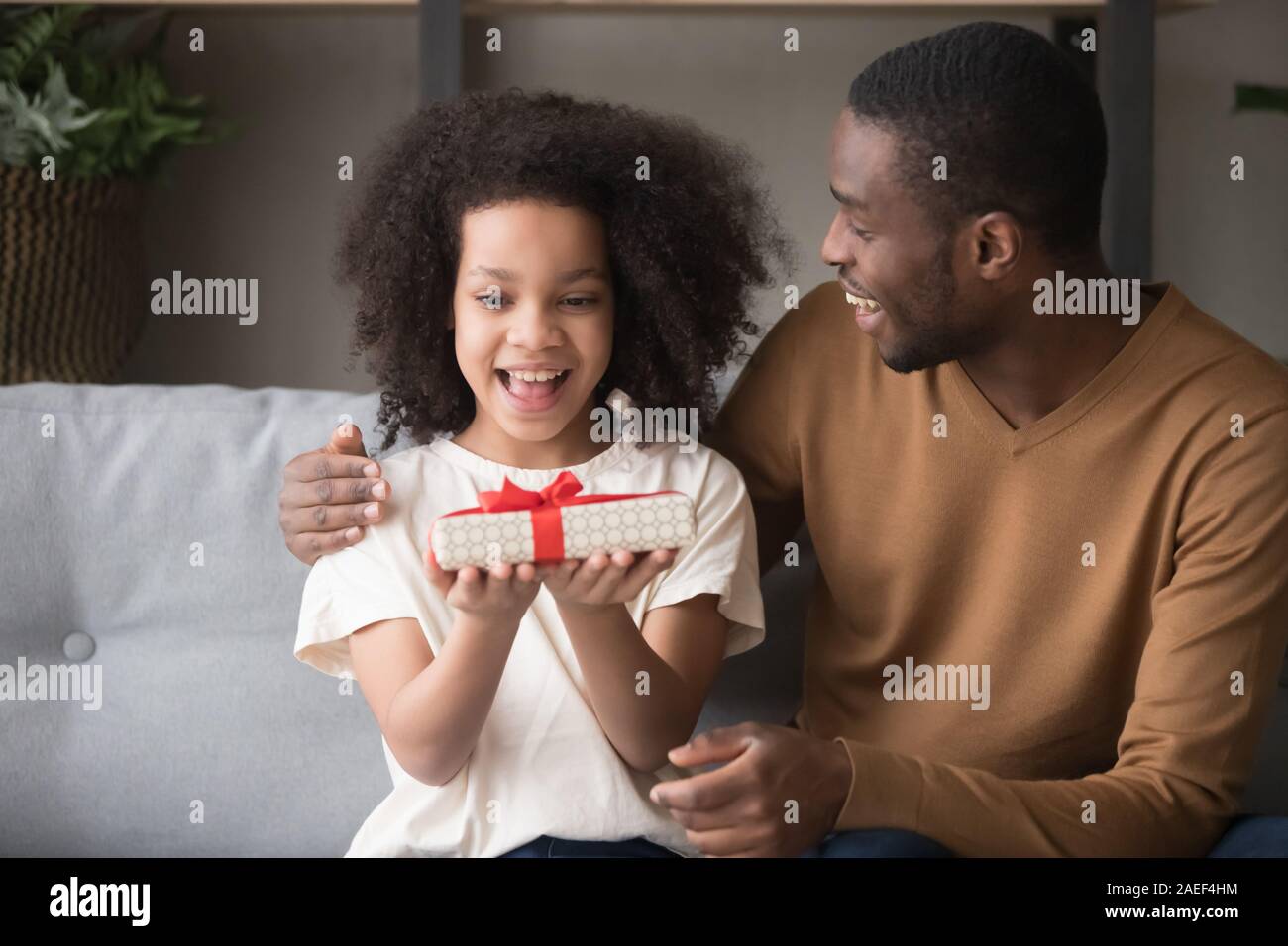 Happy emotional girl surprise gift hi-res stock photography and images ...