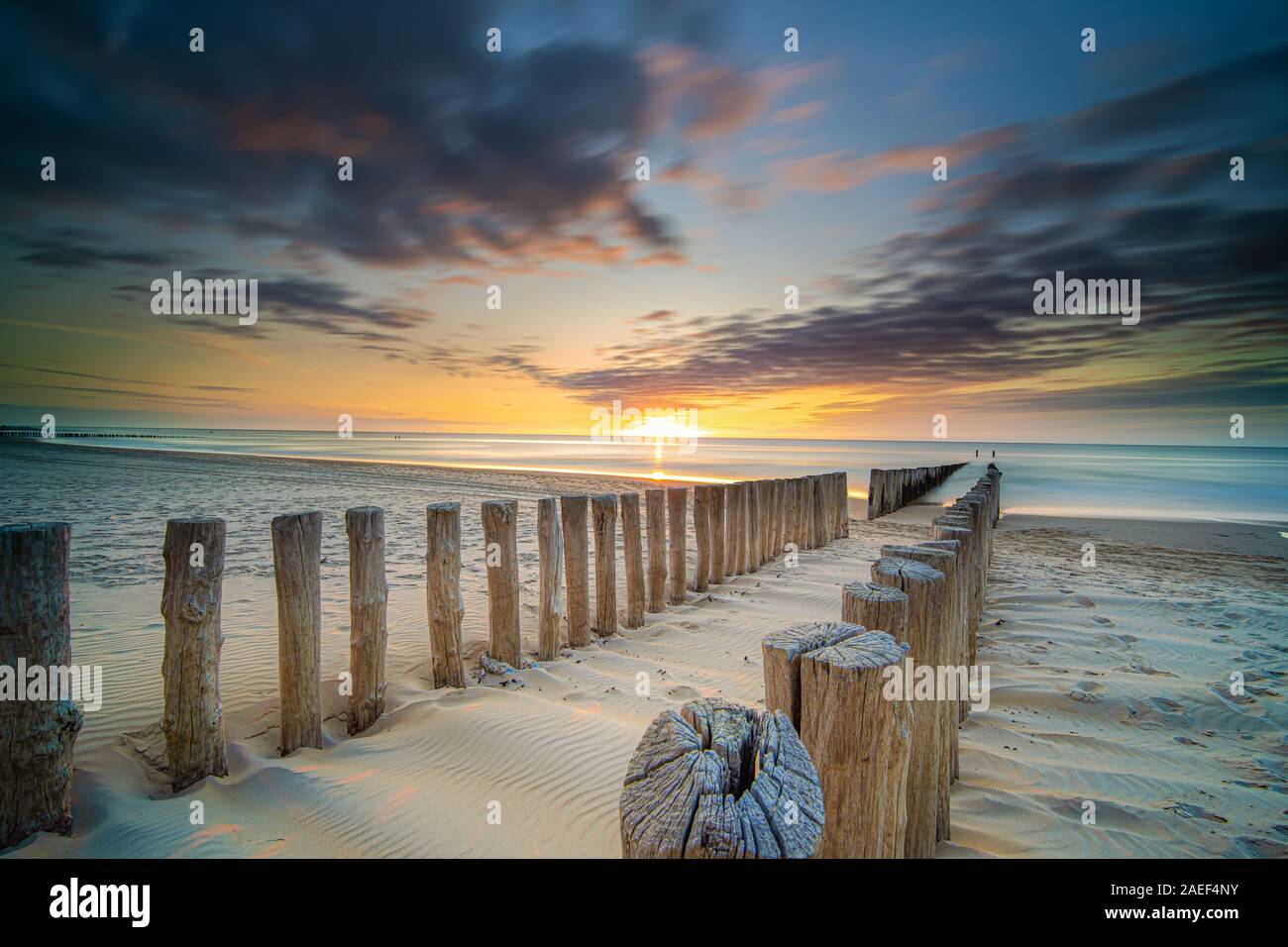 Pole heads or wave-breakers close-up disappearing in North Sea in ...