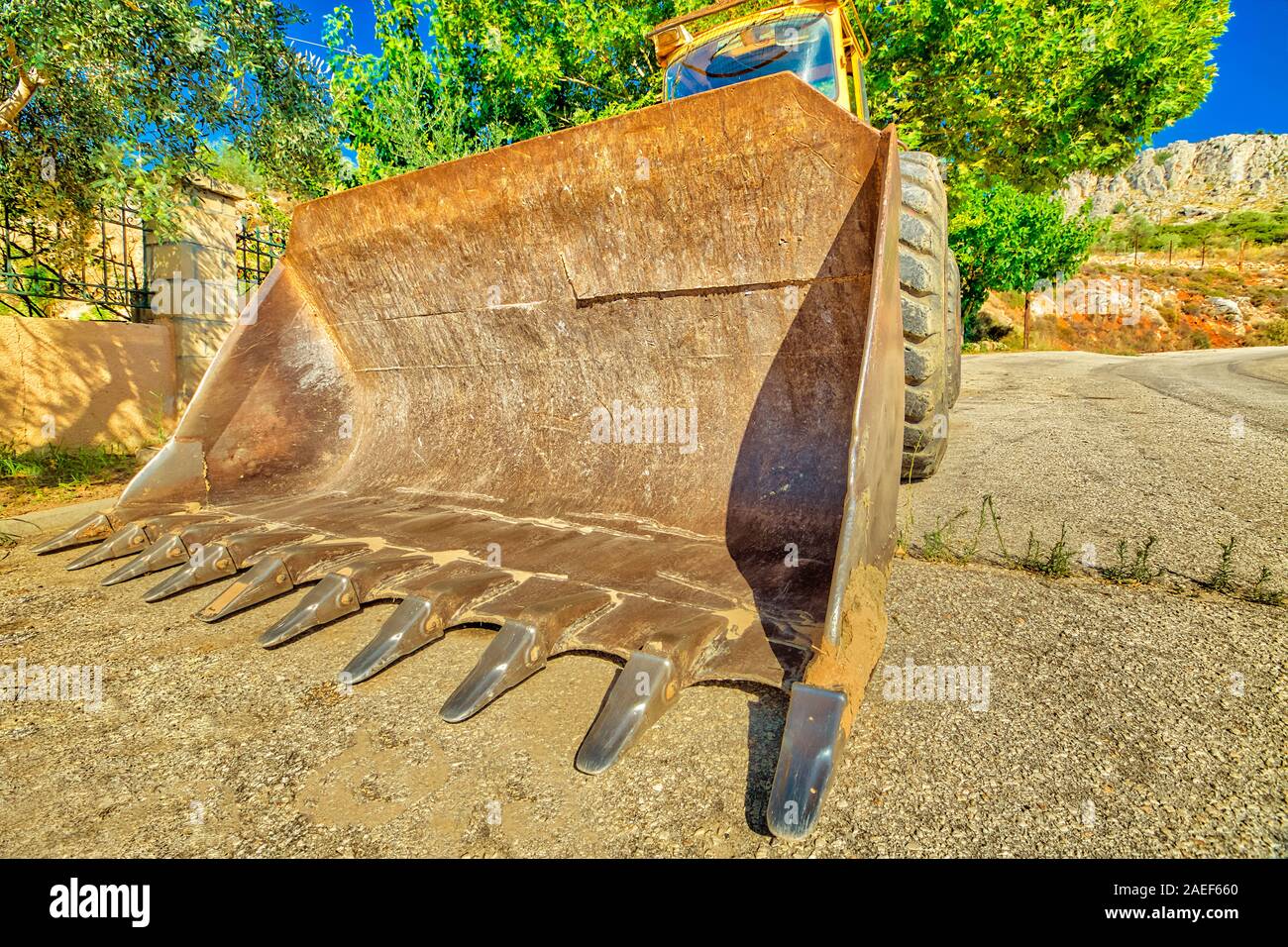 Wide angle and bottom view of yellow bulldozer excavator on wheels for ...