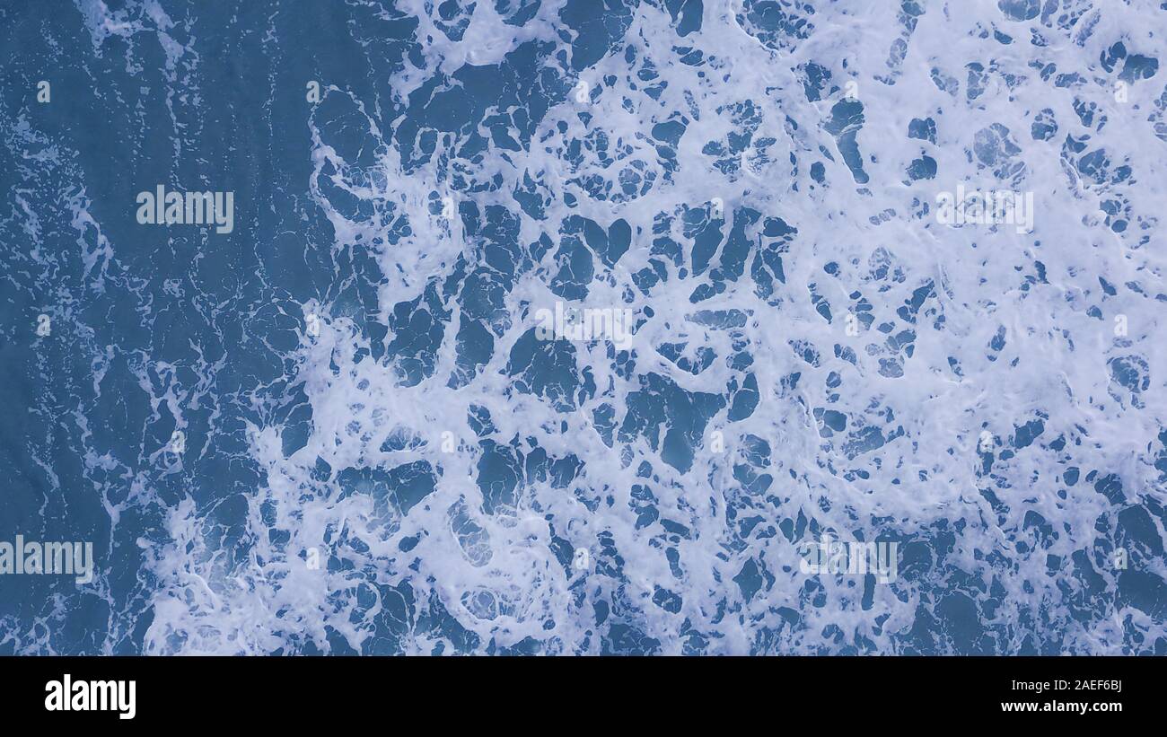 Background waves of the sea with sea foam Stock Photo - Alamy