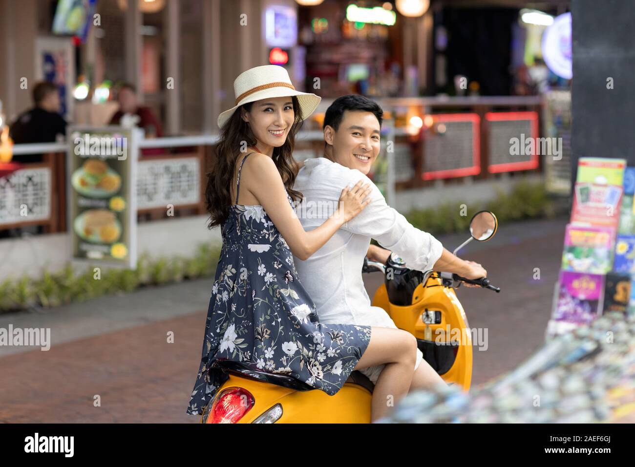 Rear view of young couple riding motorcycle hi-res stock photography ...