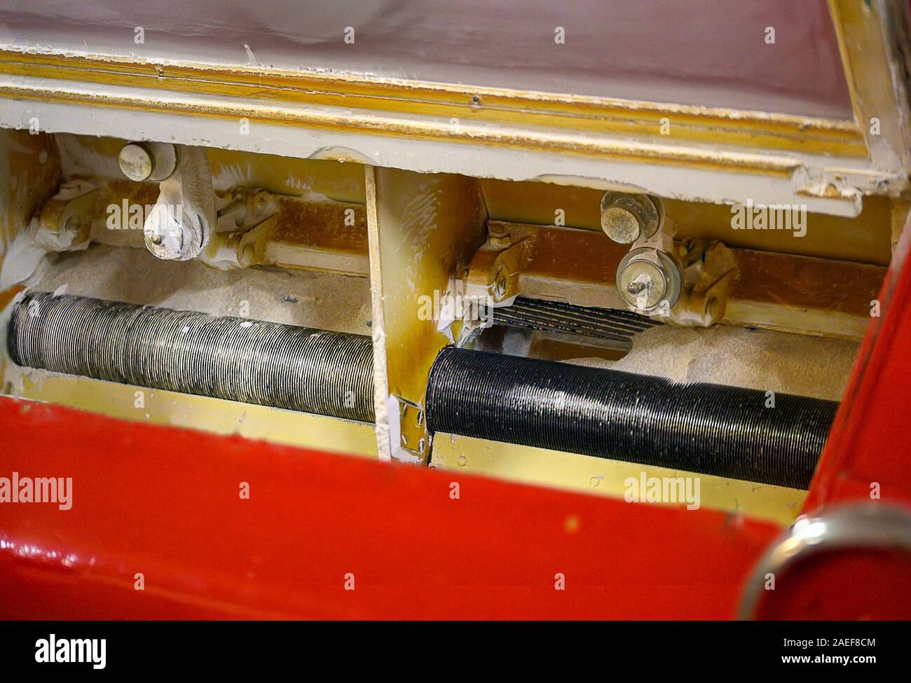 fine cylindrical rollers in a red roller mill of a corn mill Stock ...