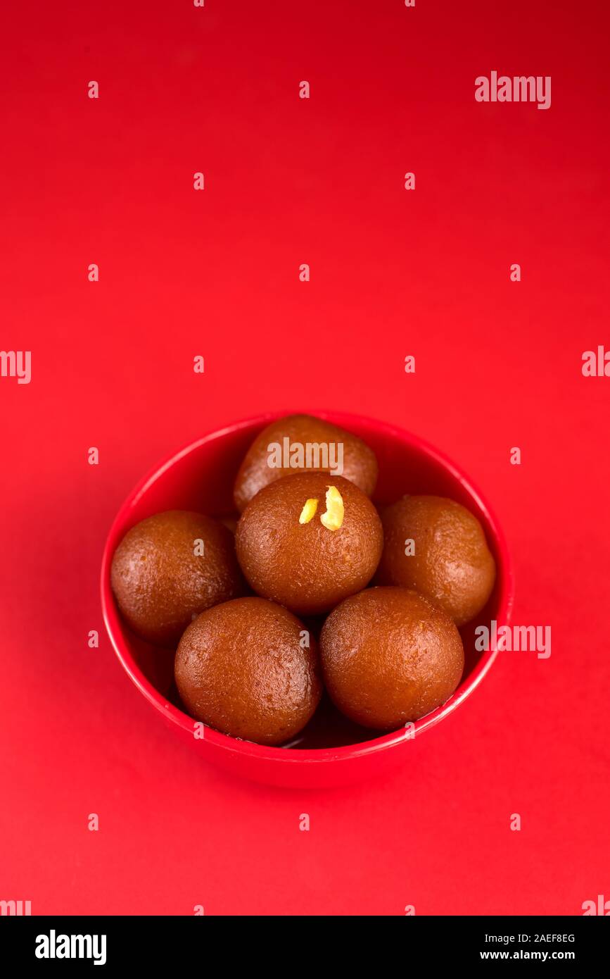 Gulab Jamun in red bowl on red background. Indian Dessert or Sweet Dish ...