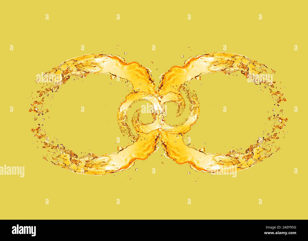 Creative infinity symbol from splashing light beer on an yellow ...