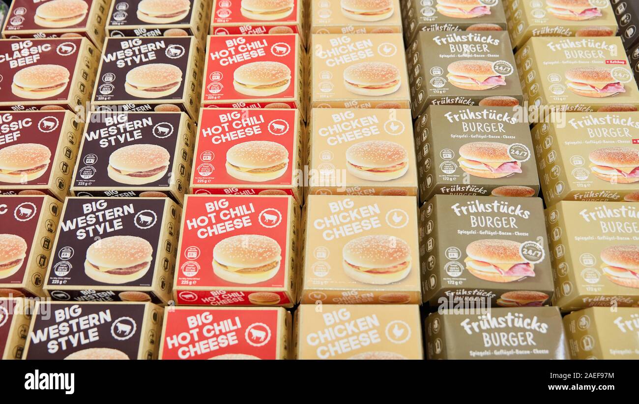 COLOGNE, OCTOBER 2019: Hamburger and cheeseburger in wrapper at ANUGA ...