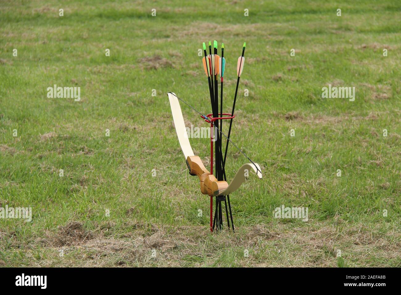 A Sports Archery Bow and Arrows on a Stand Stock Photo - Alamy