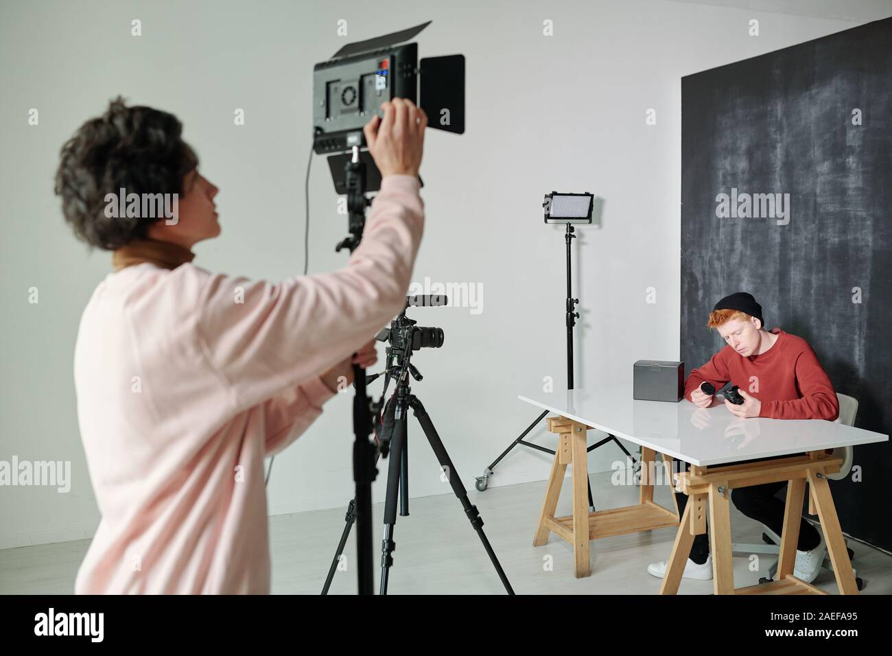 Young photographer preparing camera hi-res stock photography and images ...