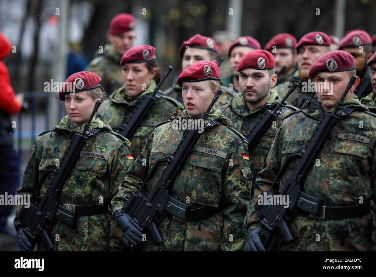 Bucharest, Romania - December 01, 2019: German female soldier is taking ...