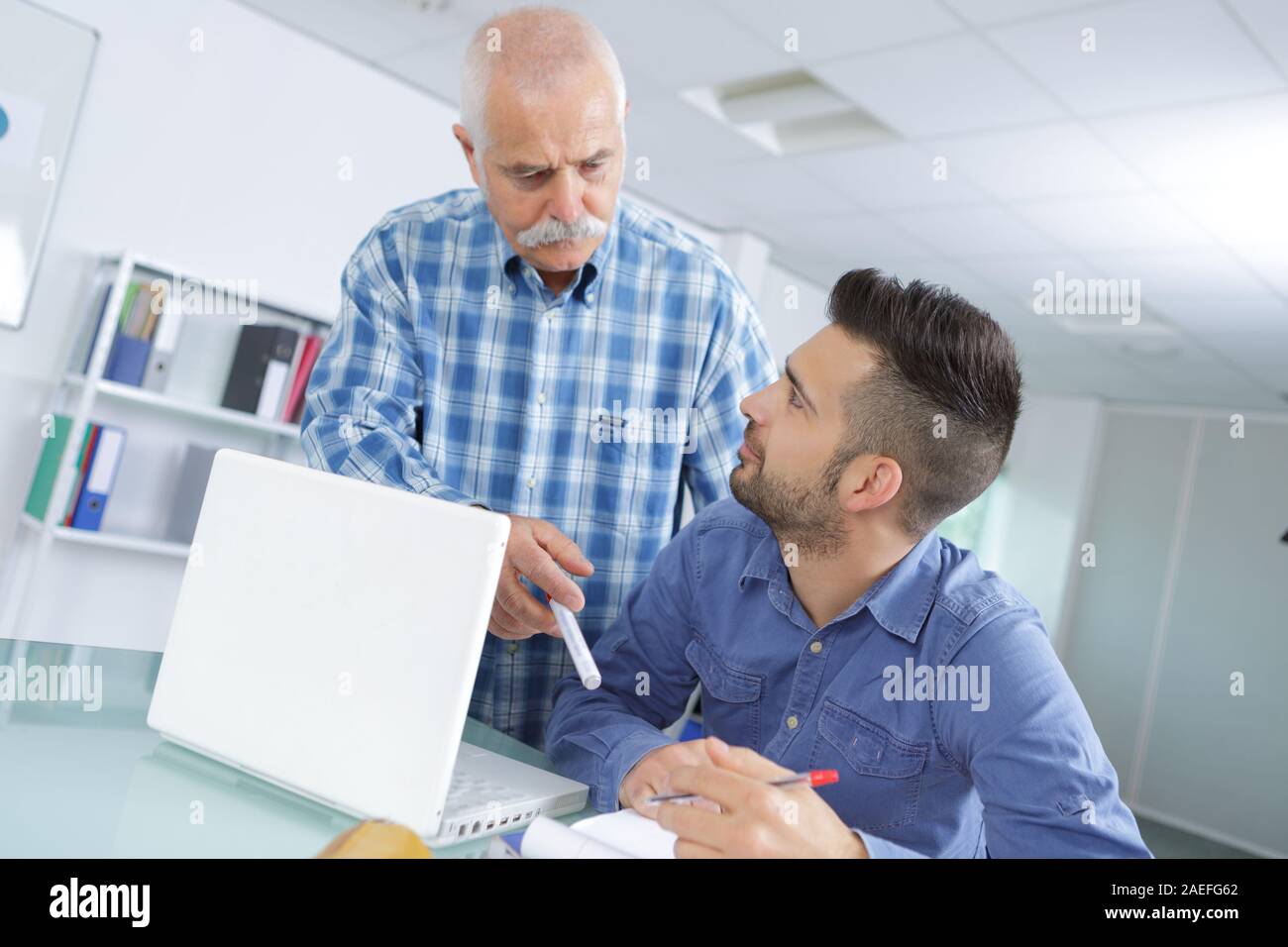 Young man laptop turning hi-res stock photography and images - Alamy