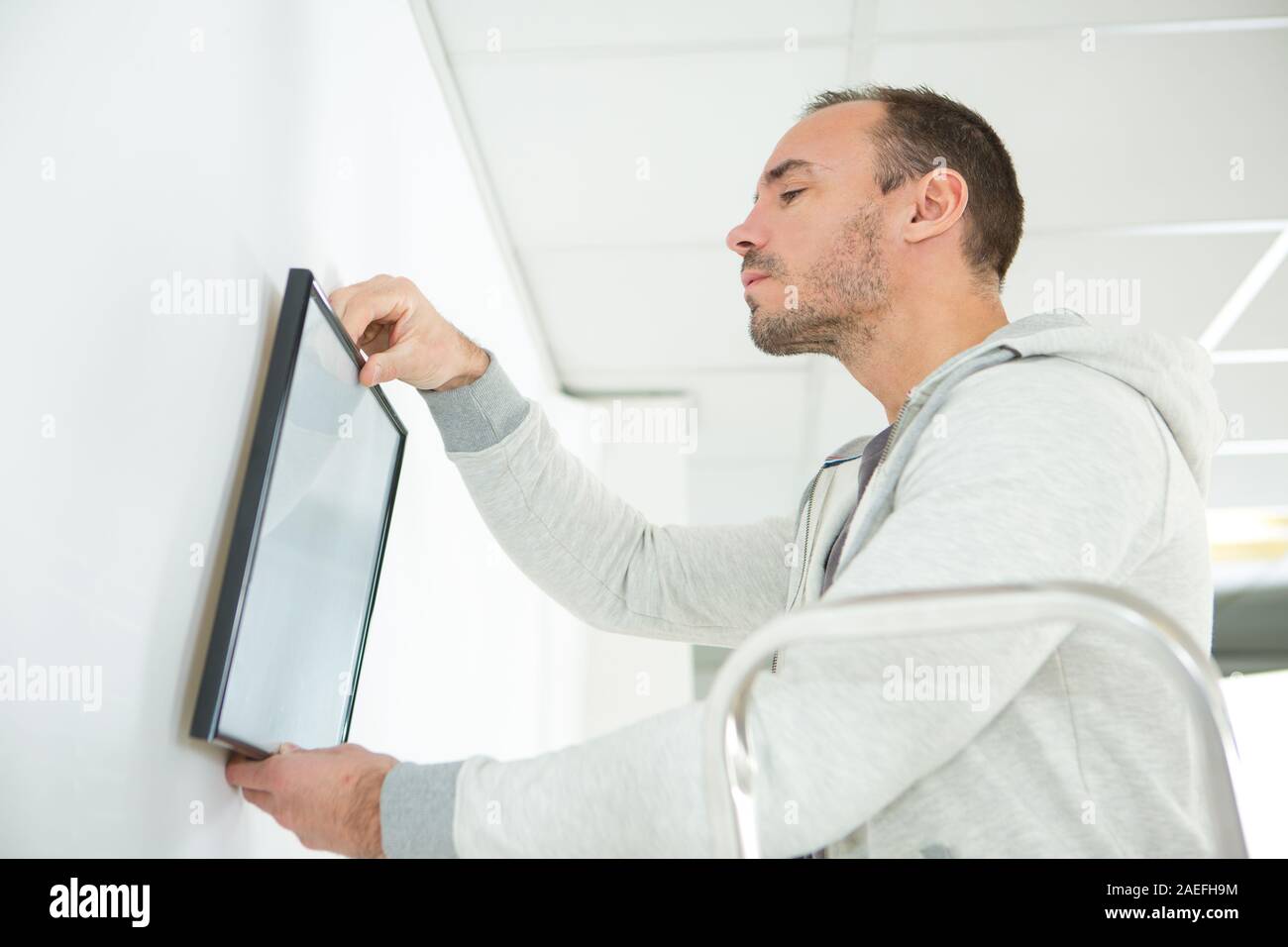Hammer man hanging hi-res stock photography and images - Alamy