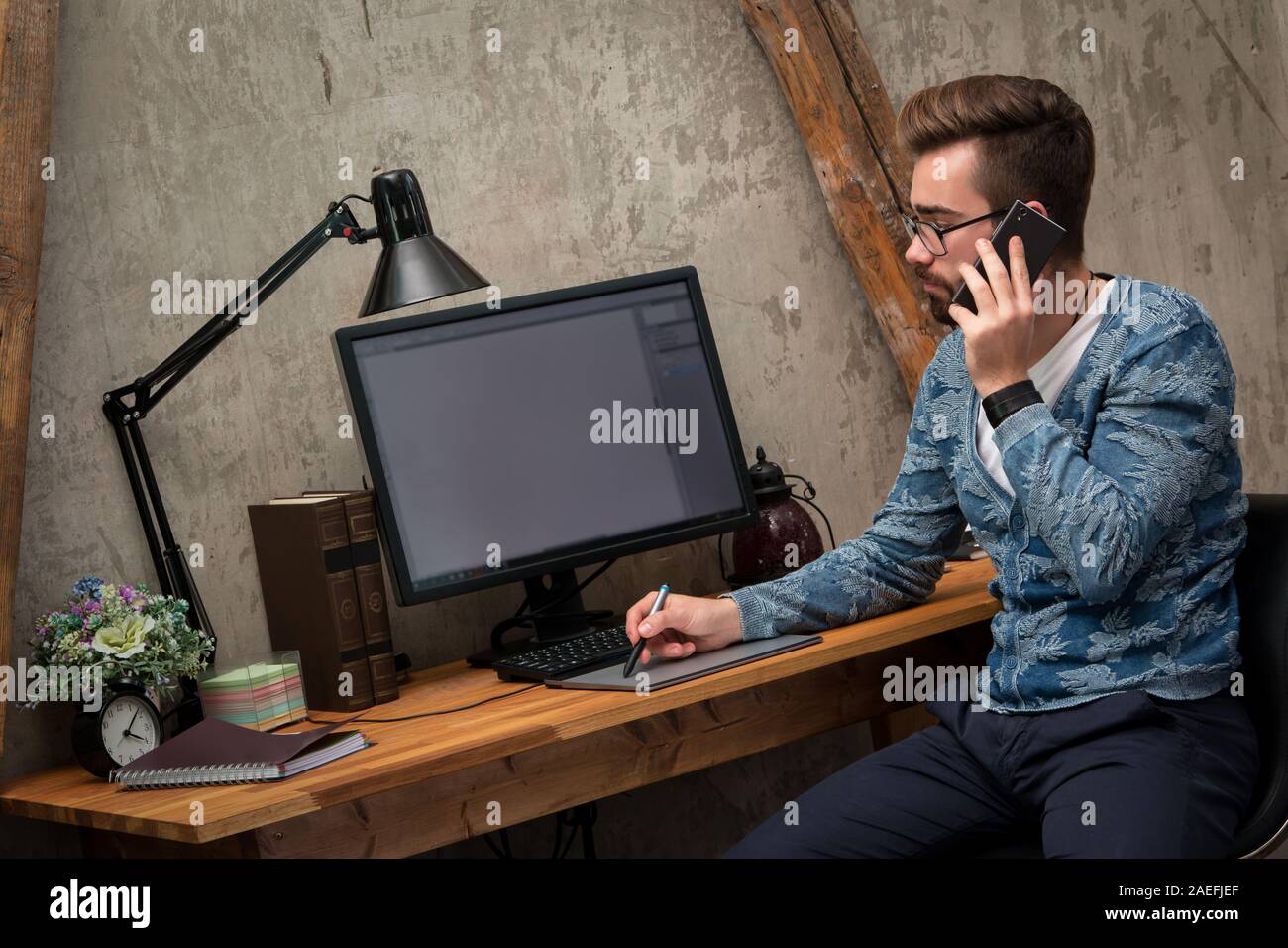 Handsome editor working graphics hi-res stock photography and images ...