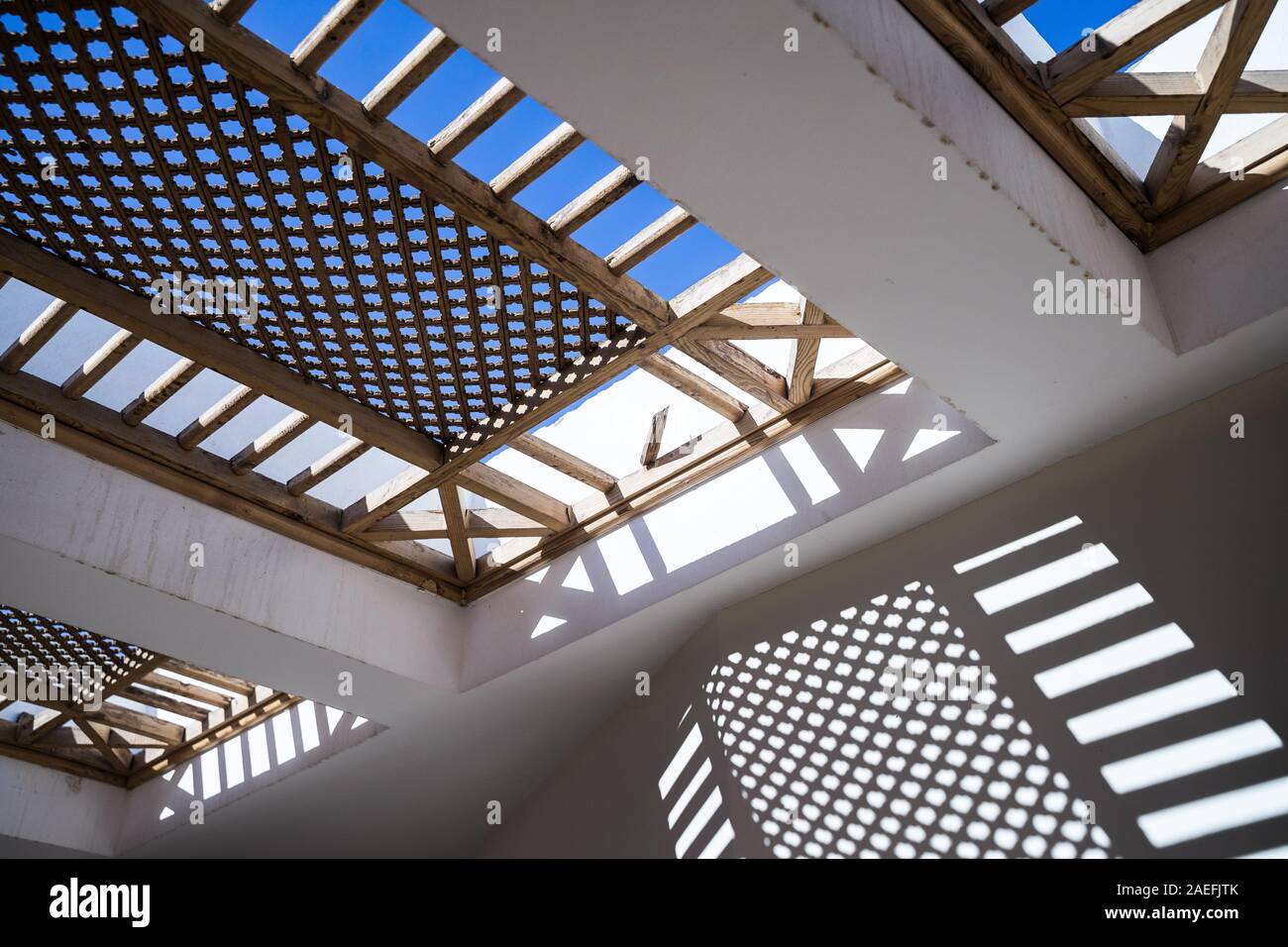 Wooden lattice and its Shadow on a wall. Distance. Oriental Style Stock ...