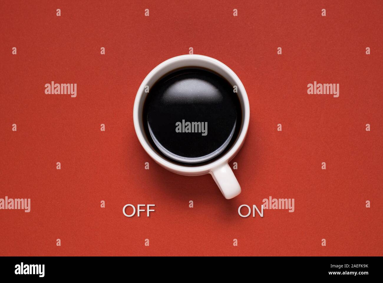Fun concept of a mug of coffee control switch Stock Photo - Alamy