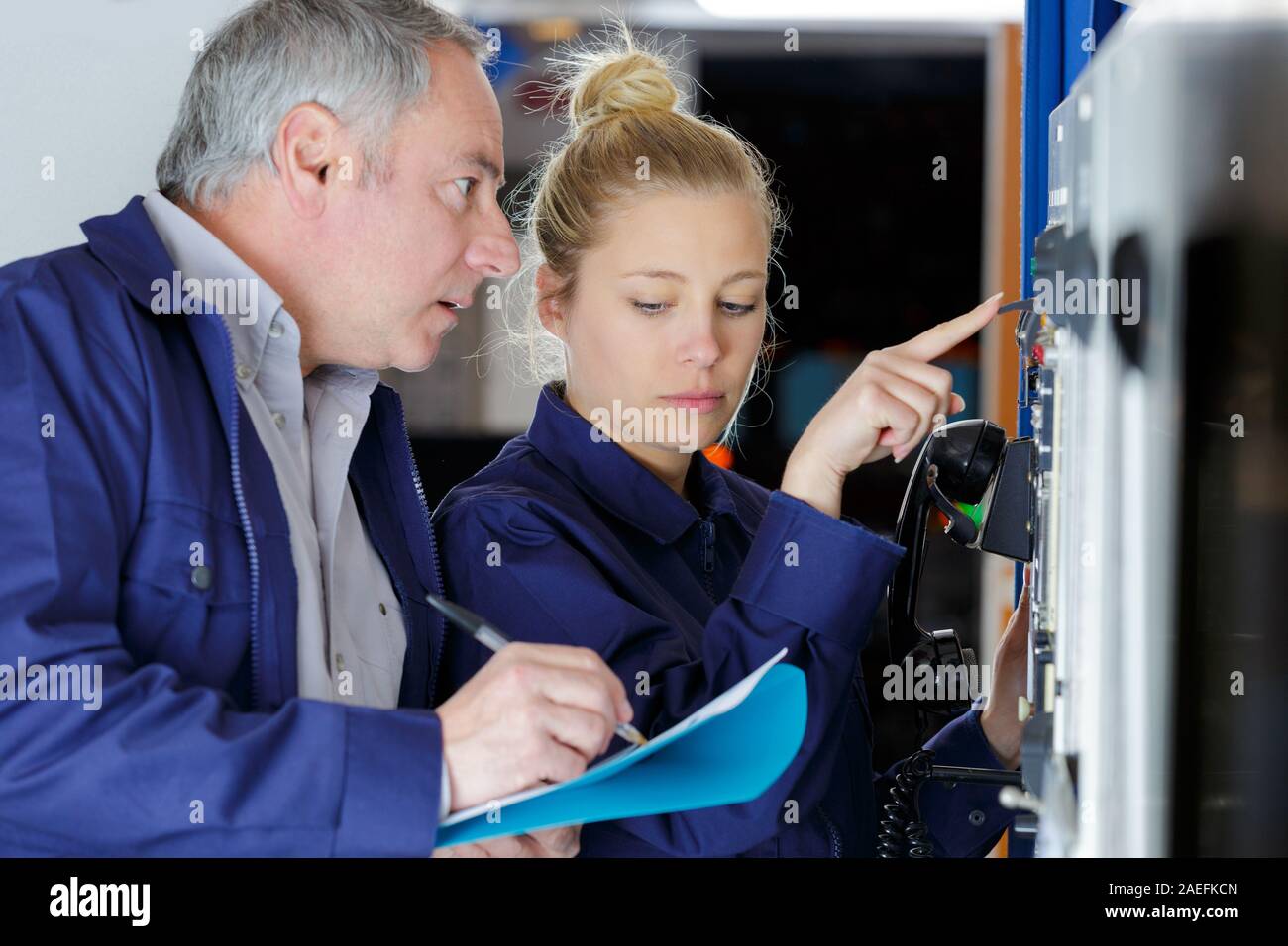 maintenance engineer operating a control panel Stock Photo - Alamy